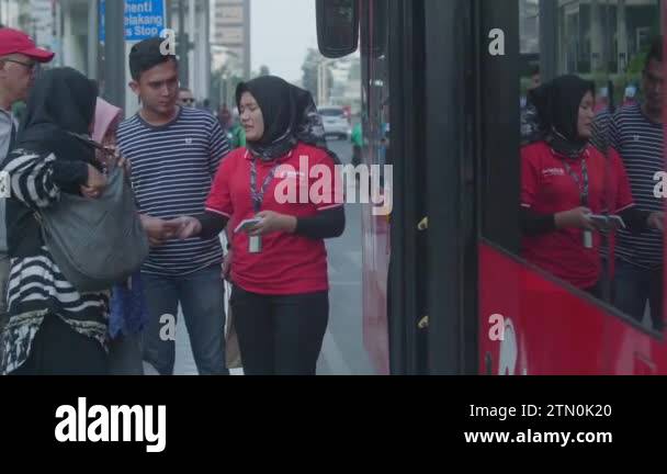 Jakarta, Indonesia - June 20, 2023 : A Trans Jakarta bus official is ...