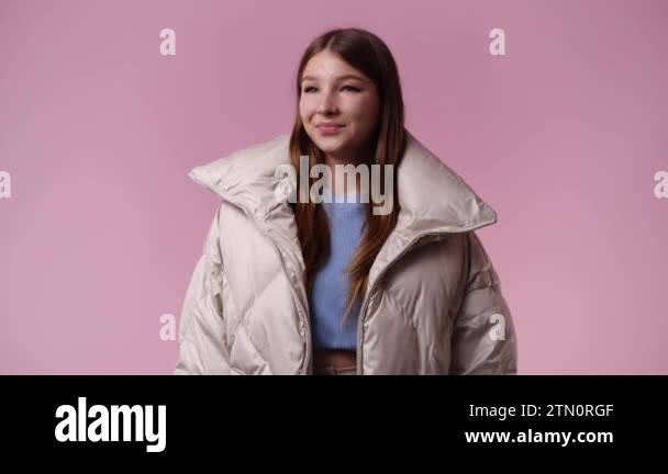 4k video of girl with cunning facial expression on pink background ...