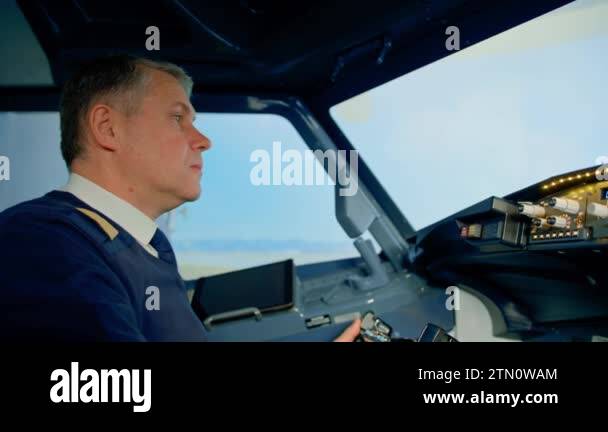 the pilot of a modern passenger plane holds the rudder control lever ...