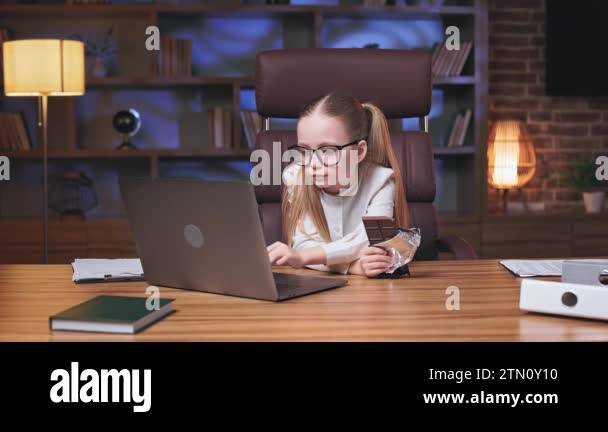 Enchanting little girl browsing web pages in internet on portable ...