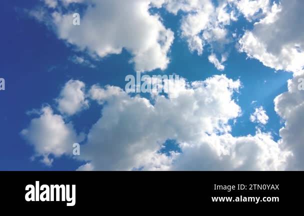 Blue sky white clouds. Puffy fluffy white clouds. Cumulus cloud cloudscape timelapse. Summer ...