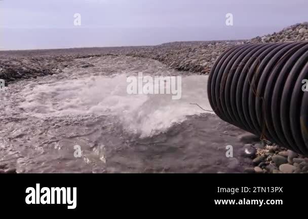 Pollution of sea and ocean, mountains. Ecology. Sewage from sewer pipe ...