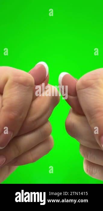 chromakey, woman shows two hands close-up she has a french manicure she ...