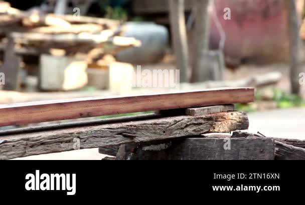 smoothing wood Industrial carpenter worker using electric wood planer ...