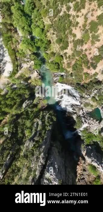 Immerse yourself in the enchantment of a magical waterfall with azure ...