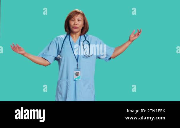 Confused asian nurse frustrated about not knowing answer to patient ...