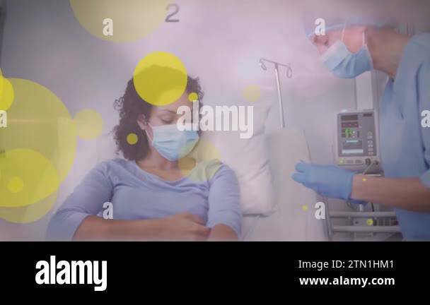 Animation of yellow spots over caucasian female doctor giving an ...