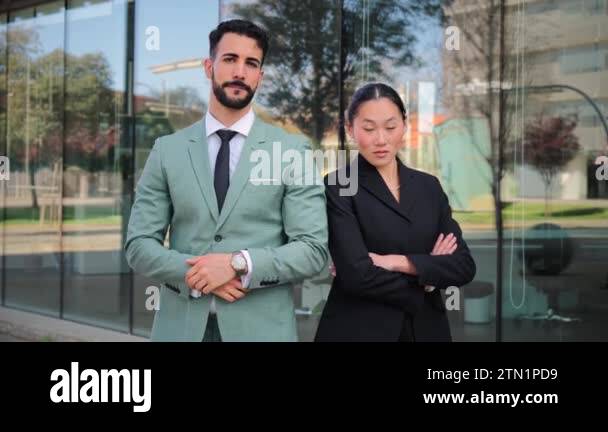 Young arms crossed executive coworkers standing looking at camera at ...