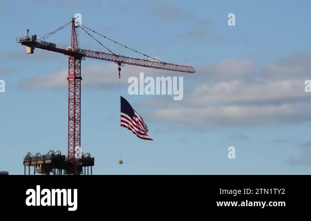 American Flag Flying High on July 4th Independence Day against Blue Sky ...