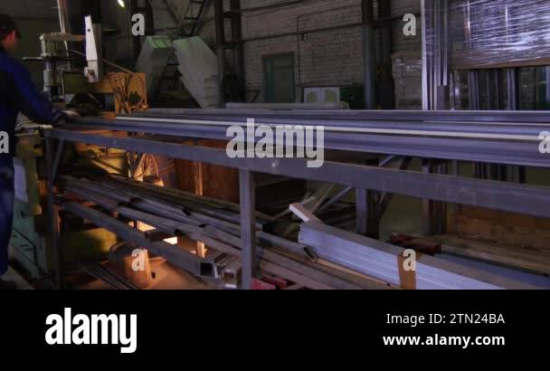 Rolling mill machine for rolling steel sheet. Tilt shift effect. Worker ...