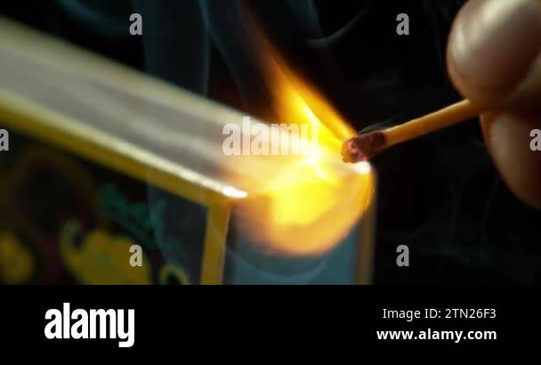 Match, orange flame and hand with matchbox stroke with sparks, fire and ...
