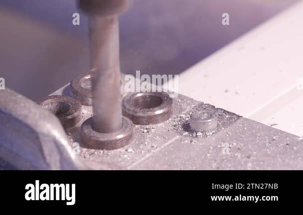 Hole being drilled into aluminium and metal using electric drill ...