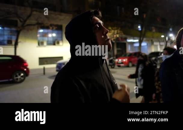 Smoke-filled bonding: young guy of latino/caucasian background ...