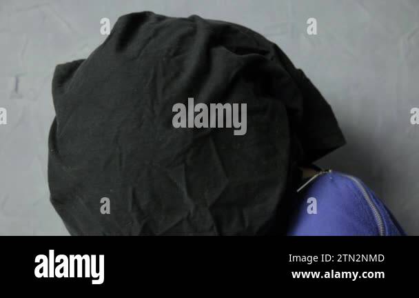 frightened girl black cloth bag on her head and gagged sits on the ...