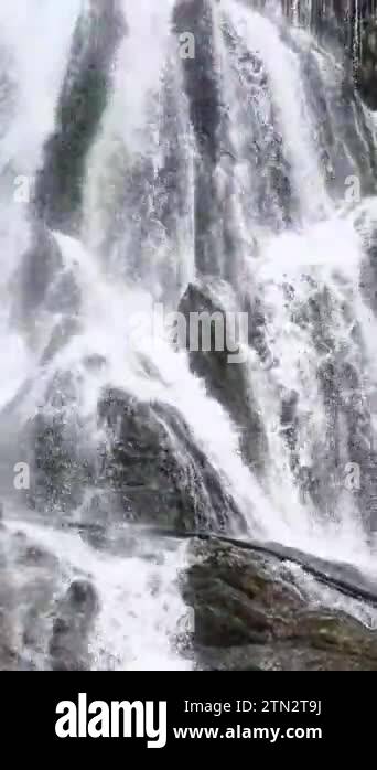 Capture the mesmerizing beauty of a waterfall from an aerial ...