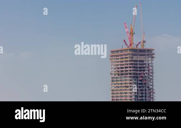 Many tower cranes working on the construction site of new skyscraper of ...