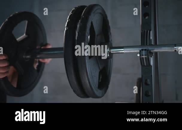 close up of handsome bodybuilder guy prepare to do exercises with ...