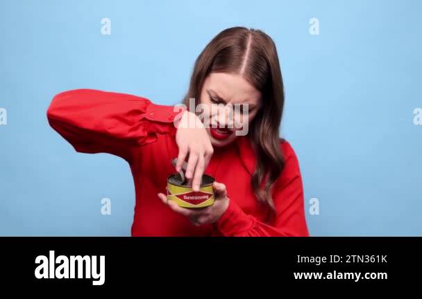Emotional young girl eating traditional swedish dish - salted fermented ...