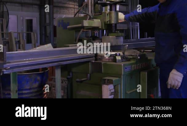 Rolling mill machine for rolling steel sheet. Tilt shift effect. Worker ...