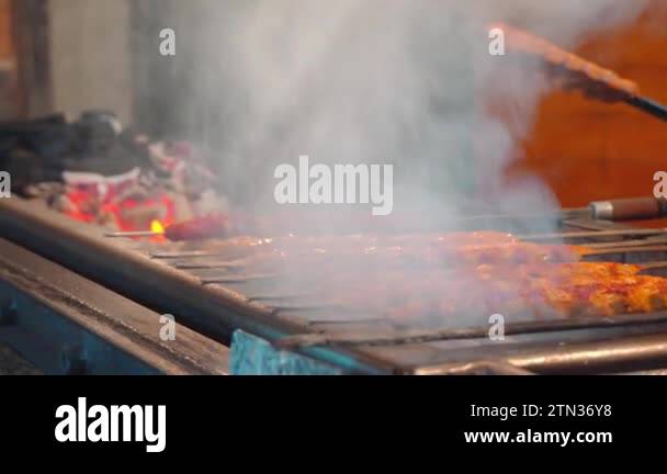 New concept of cooking meat on charcoal with smoke in cafe or ...