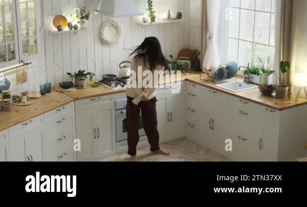 Radiant Caucasian woman exudes boundless energy and happiness while dancing enthusiastically in ...