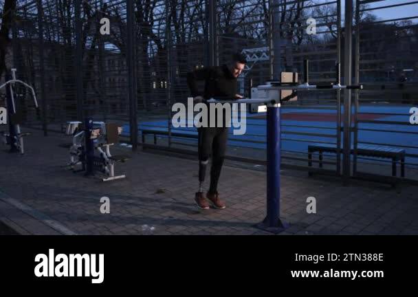 Disabled athlete, Physical fitness, Bar workout. Disabled man with ...