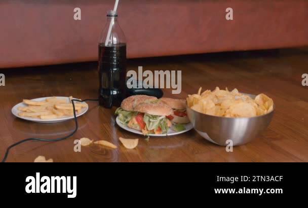 Fish and Chips meals on floor, fast food bottle of coca cola, game ...