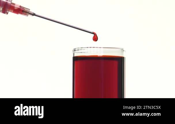 drops of blood leaking from the needle of a syringe piston Stock Video ...