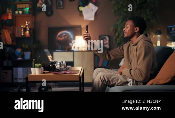 Dance Choreographer African American man using his cellphone to share ...