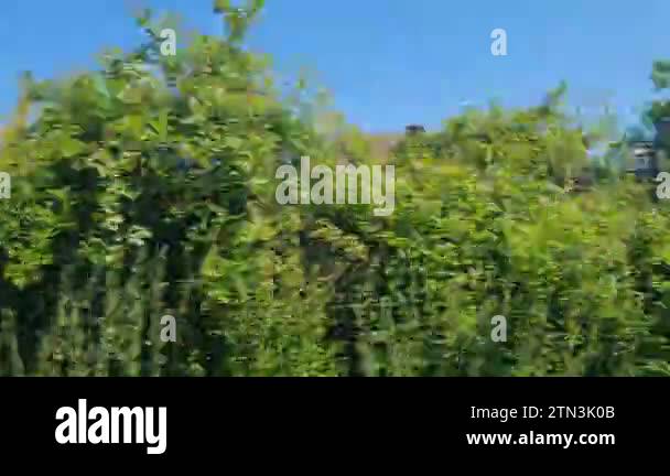 Outside View from Window Seat of Train Moving Fast to Approach Next ...