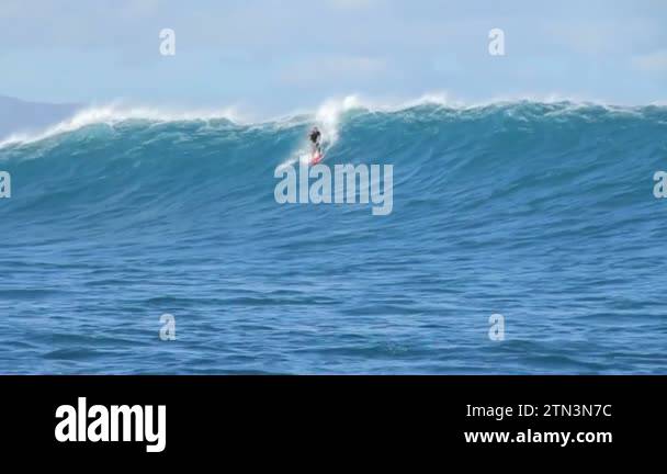 Tow In Surfer Large Wave Stock Video Footage - Alamy