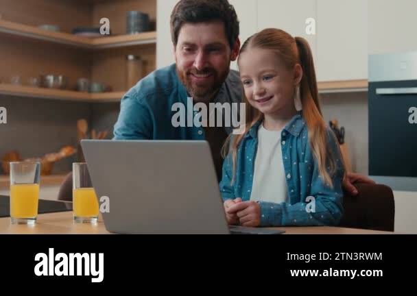 Caring father dad help daughter child girl with online task teaching ...