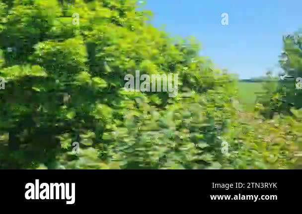 Outside View from Window Seat of Train Moving Fast to Approach Next ...