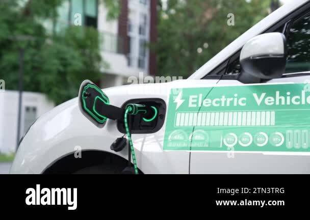 Electric car recharging in futuristic home charging station with smart digital EV battery status ...