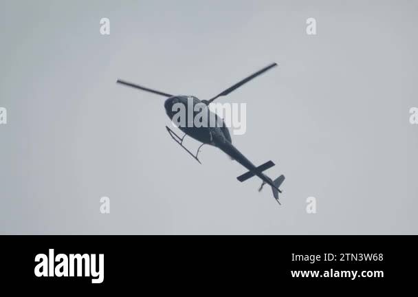 Helicopter flying in the sky low angle shot footage. Helicopter in ...