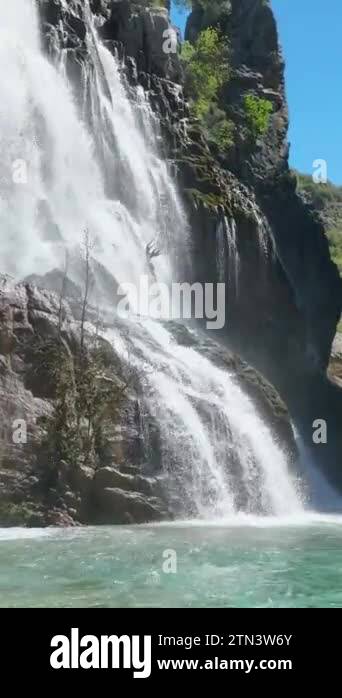 Witness the symphony of an azure waterfall as the drone embarks on an ...