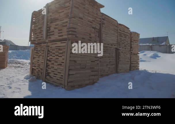 Wooden beams and boards neatly stacked in a pyramid shape Stock Video ...