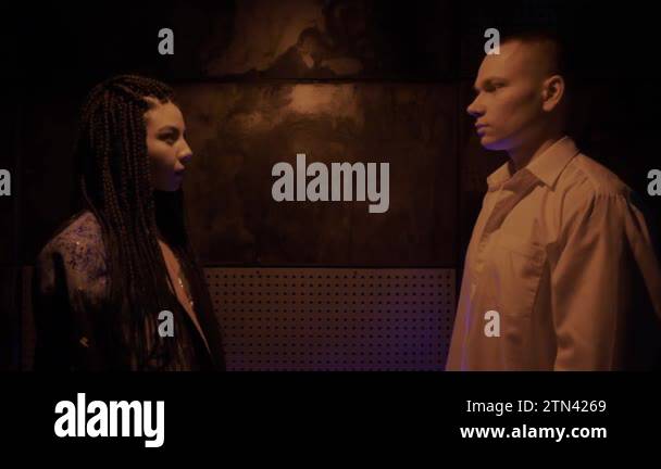 Young asian woman and caucasian man face to face, confrontation. Couple ...