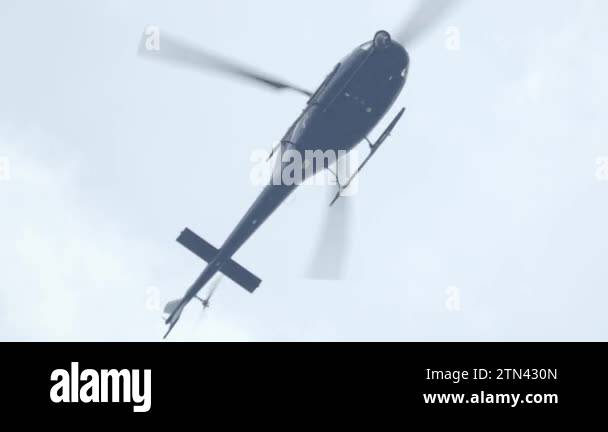 Helicopter flying in the sky low angle shot footage. Helicopter in ...