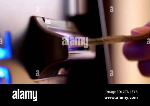 Man using an credit card inserted into ATM machine for cash withdrawal ...