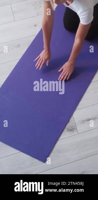 Vertical video. Indoor sport. Home exercising. Athletic slim woman ...