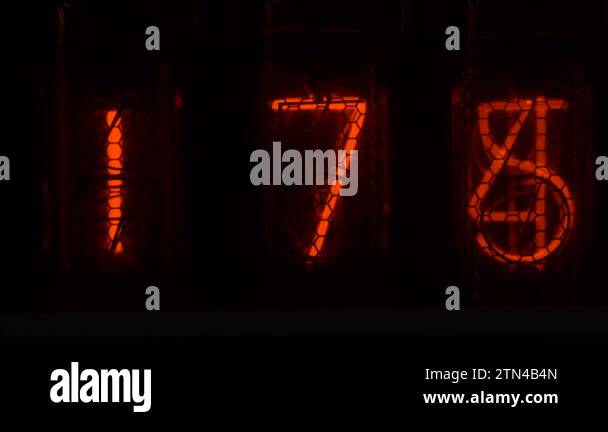 Retro vacuum tube display on the device counts seconds. Displaying ...