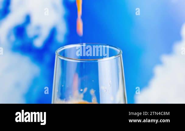Refreshing Nectar: Close-Up of Freshly Blended Fruit Juice Pouring into ...