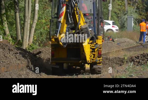 Workers Are Working Digging Yellow Excavator is Digging Building at ...