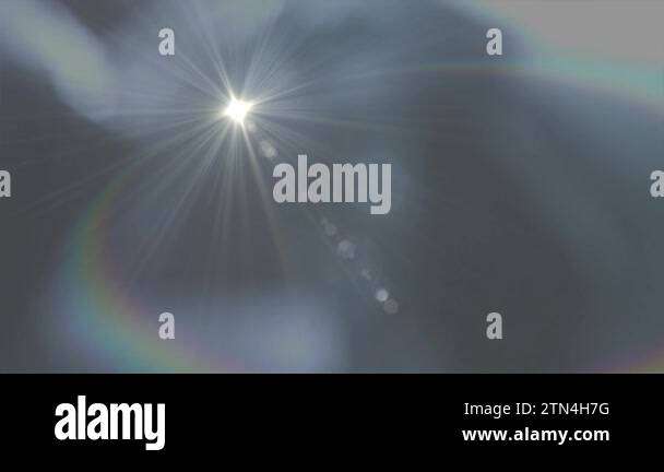 Motion light flare with rainbow ring in over light sparkle background ...