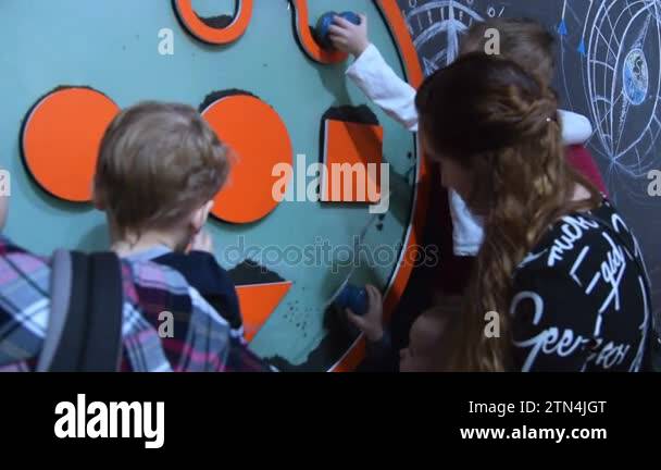 People having fun with magnet and iron powder Stock Video Footage - Alamy