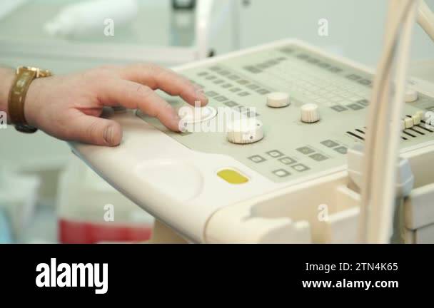 The hand with the clock on the wrist controls the ultrasound panel ...