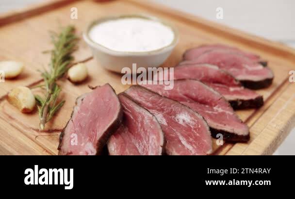 Sliced Beef Meat. Rare medium cooked beef with garlic and rosemary ...