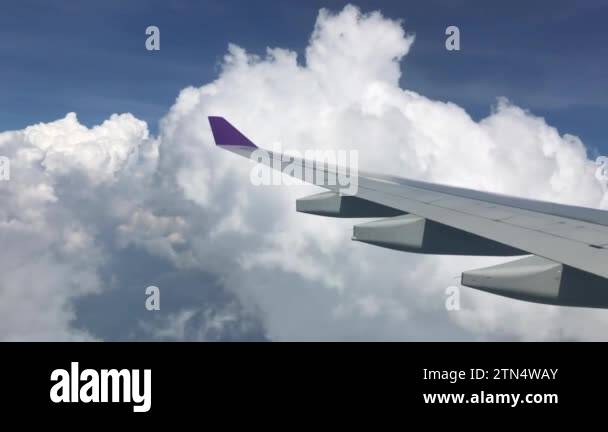airplane window View of Beautiful Cloud sky with plane wings for travel ...
