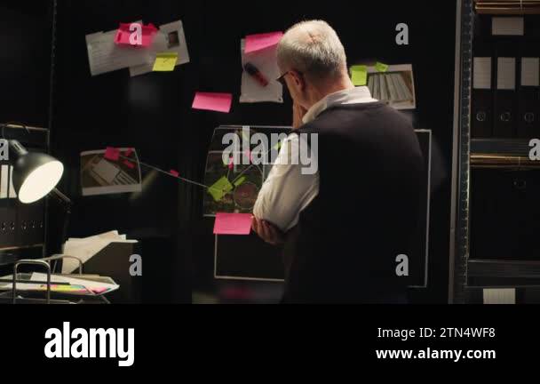 Private agent examine clues board to conduct criminal investigation ...
